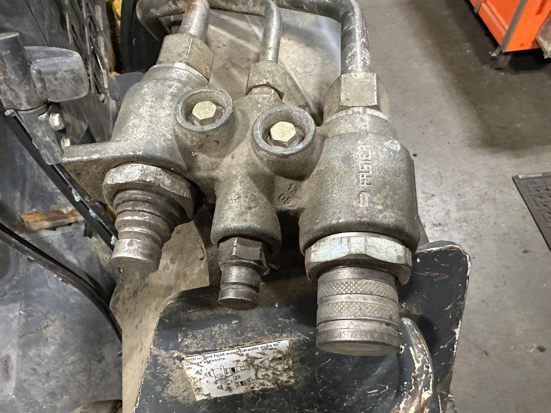 AT405633 | John Deere 329E Equip Auxiliary Coupler for Sale