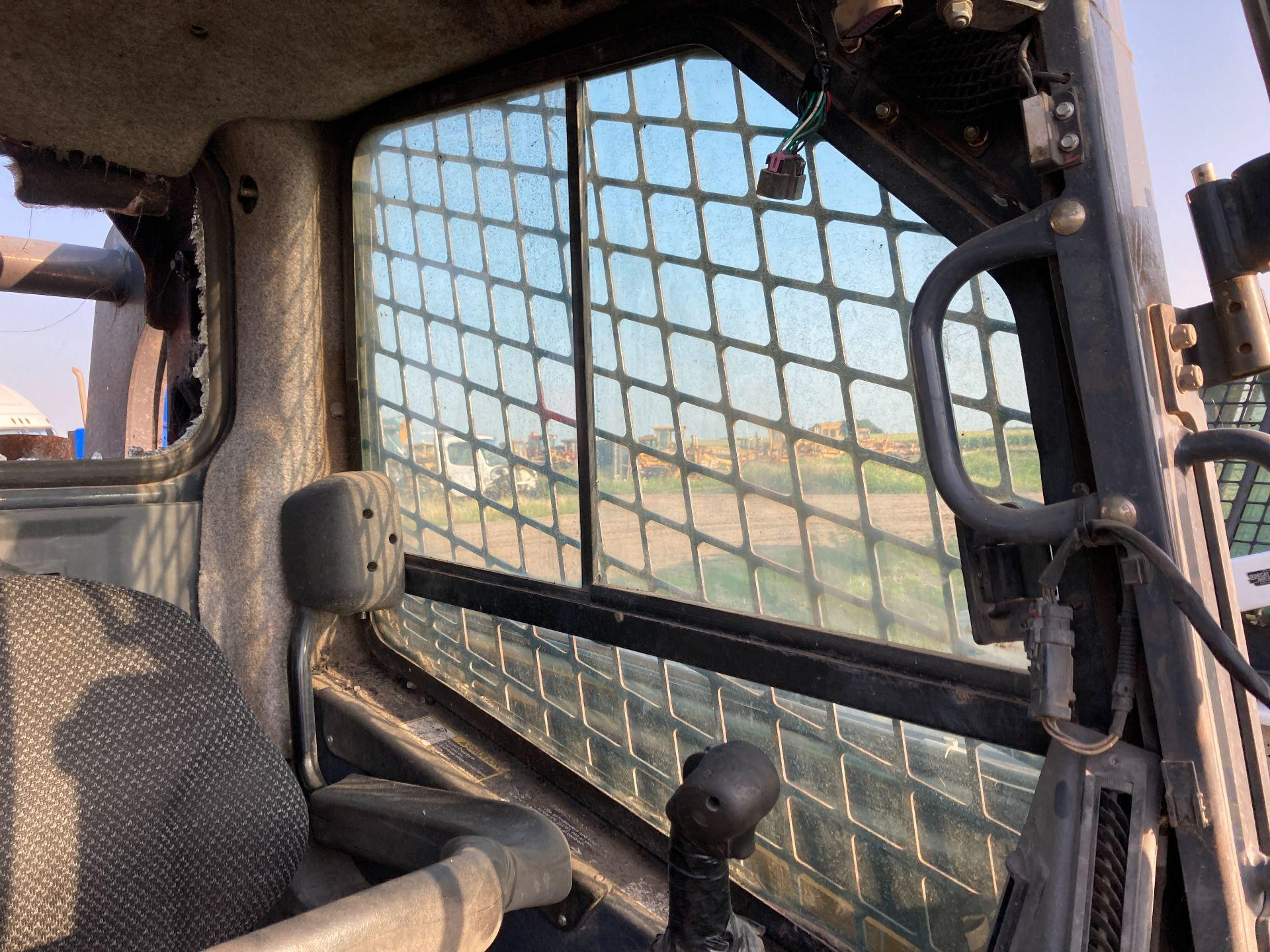 AT448879 | John Deere 333D Equip Side Glass for Sale