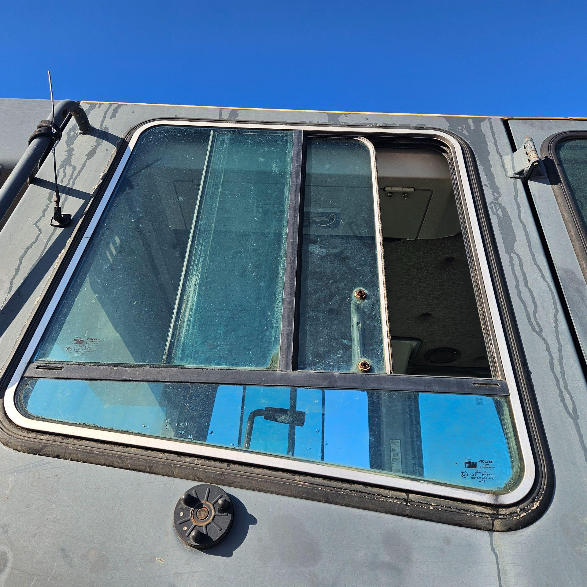 John Deere 655C Equip Side Glass for Sale