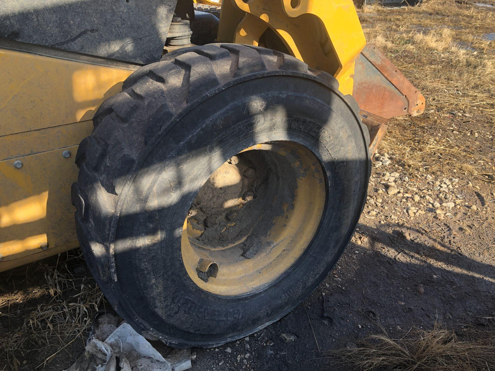 556-5845 | CAT 242D3 Tire and Rim for Sale