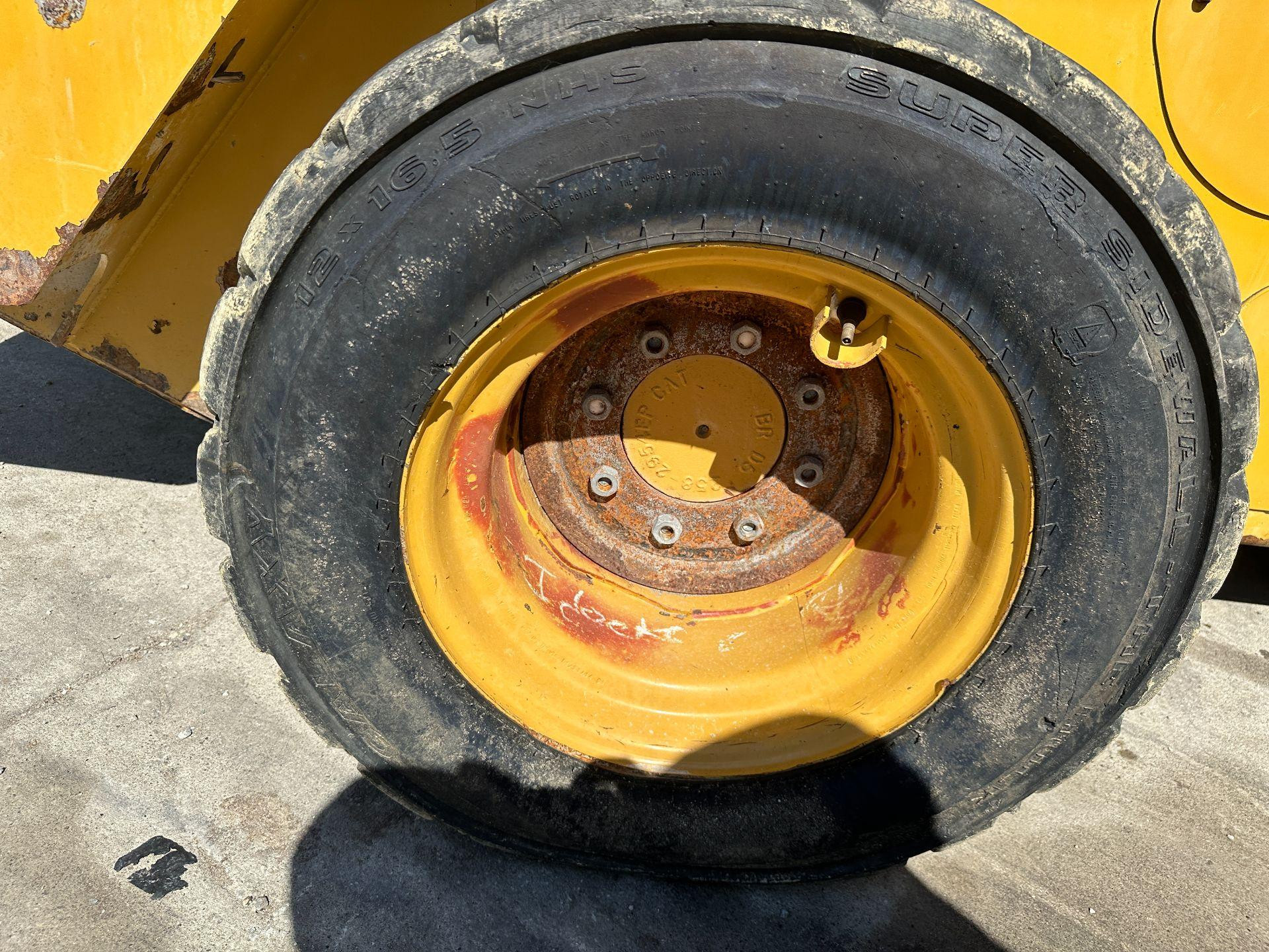 CAT 272D Tire and Rim for Sale
