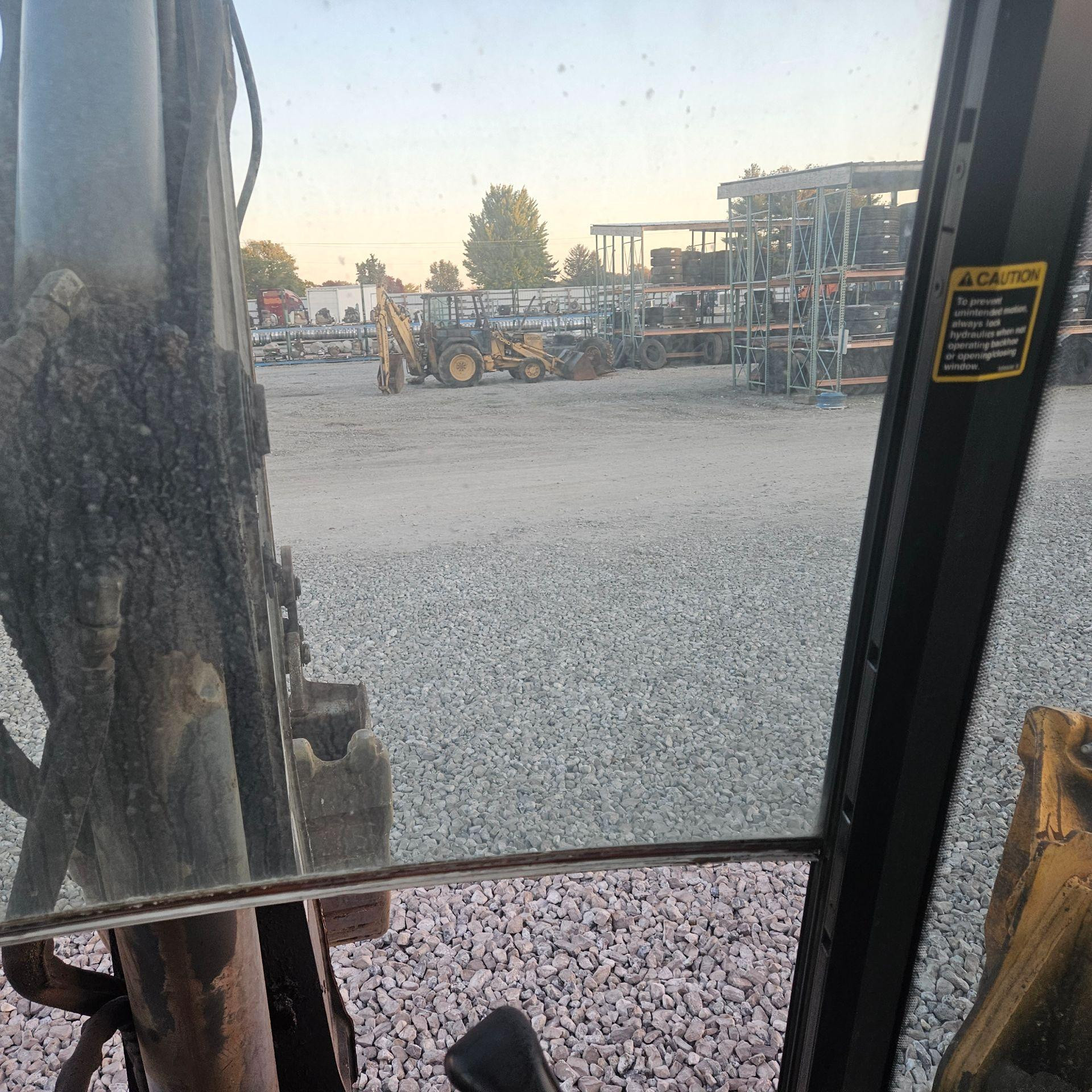 AT489146 | John Deere 410J Back Glass for Sale